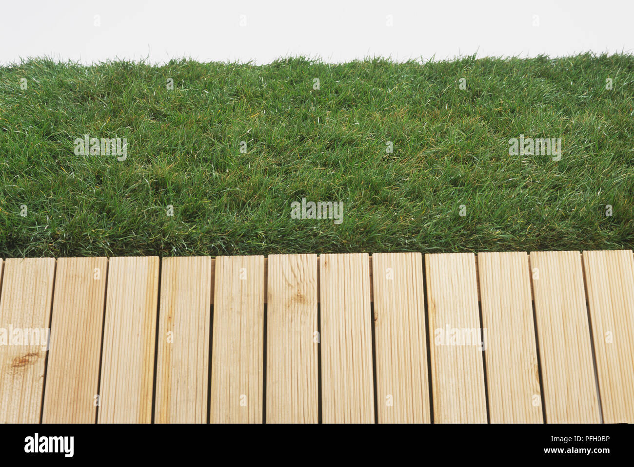 Decking laid over grass Stock Photo - Alamy