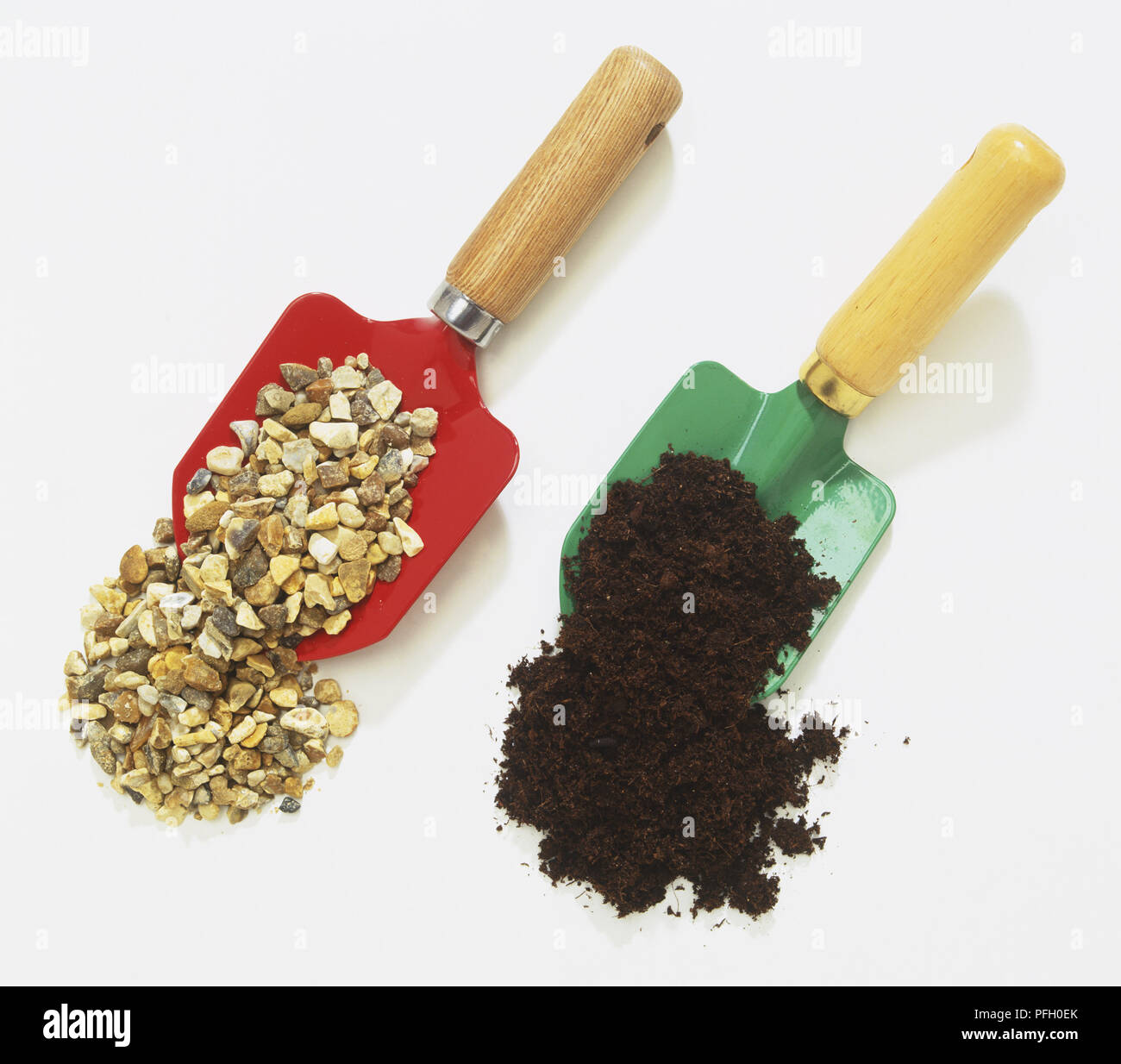 Two hand shovels filled with gravel and soil, view from above Stock ...
