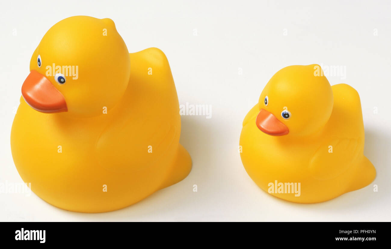 Two Rubber Ducks One Large And One Small With Orange Beaks Elevated