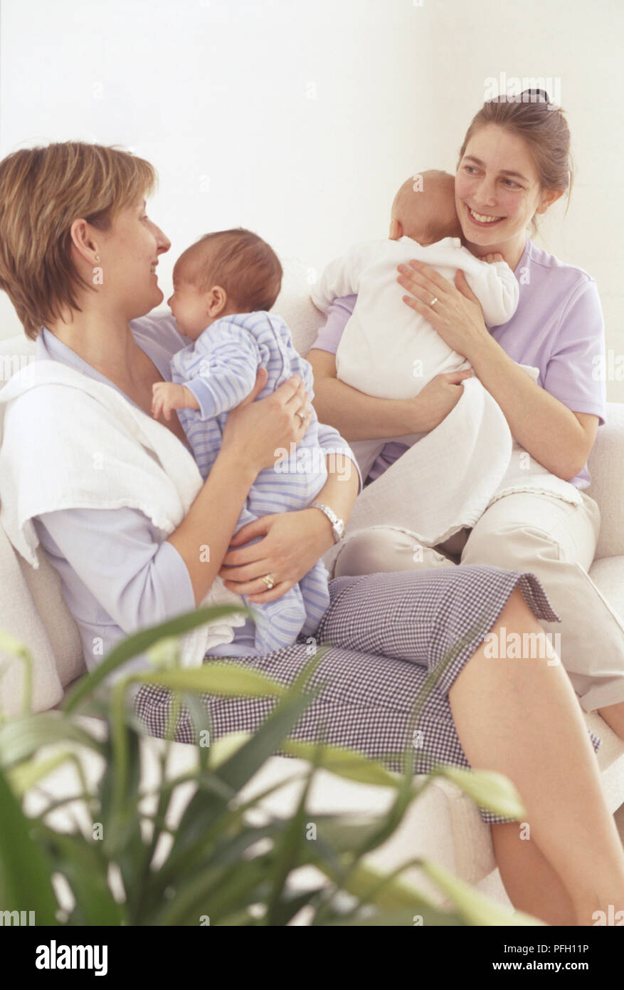 Two women sitting opposite each other hi-res stock photography and ...