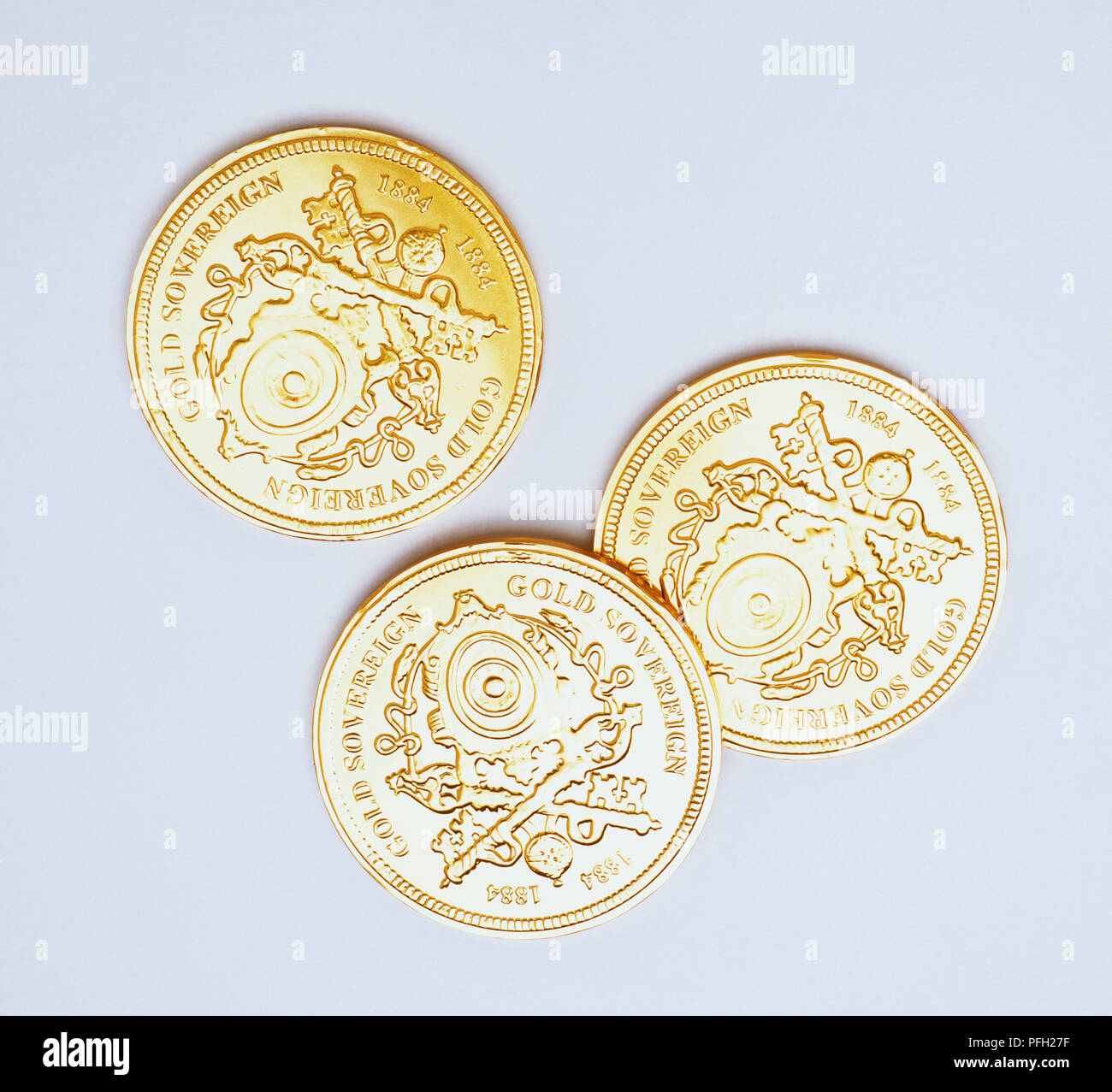 Three gold coins Stock Photo - Alamy