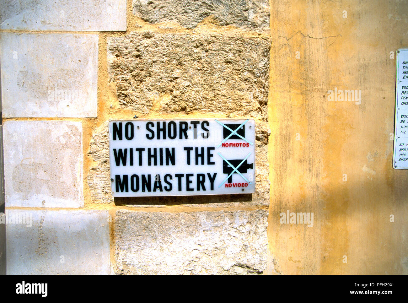 Greece, Crete, information sign on wall of monastery Stock Photo - Alamy