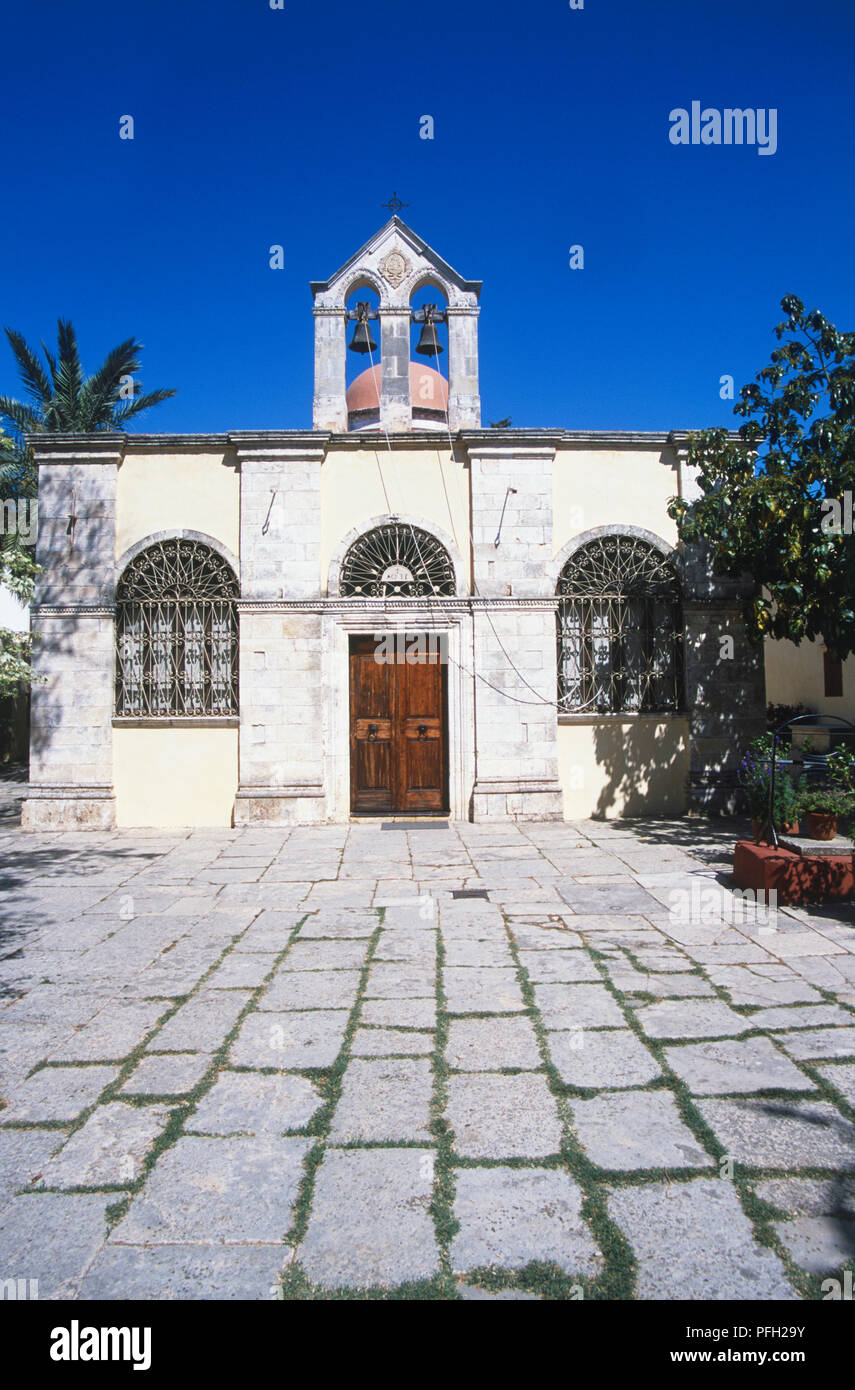 Greece, Greek Islands, Crete, facade and entrance of church with bell ...