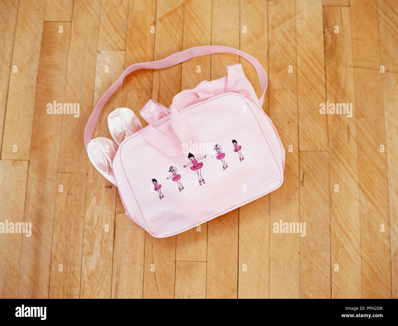 Pink bag with strap, ballet dancers printed on front, containing ballet ...