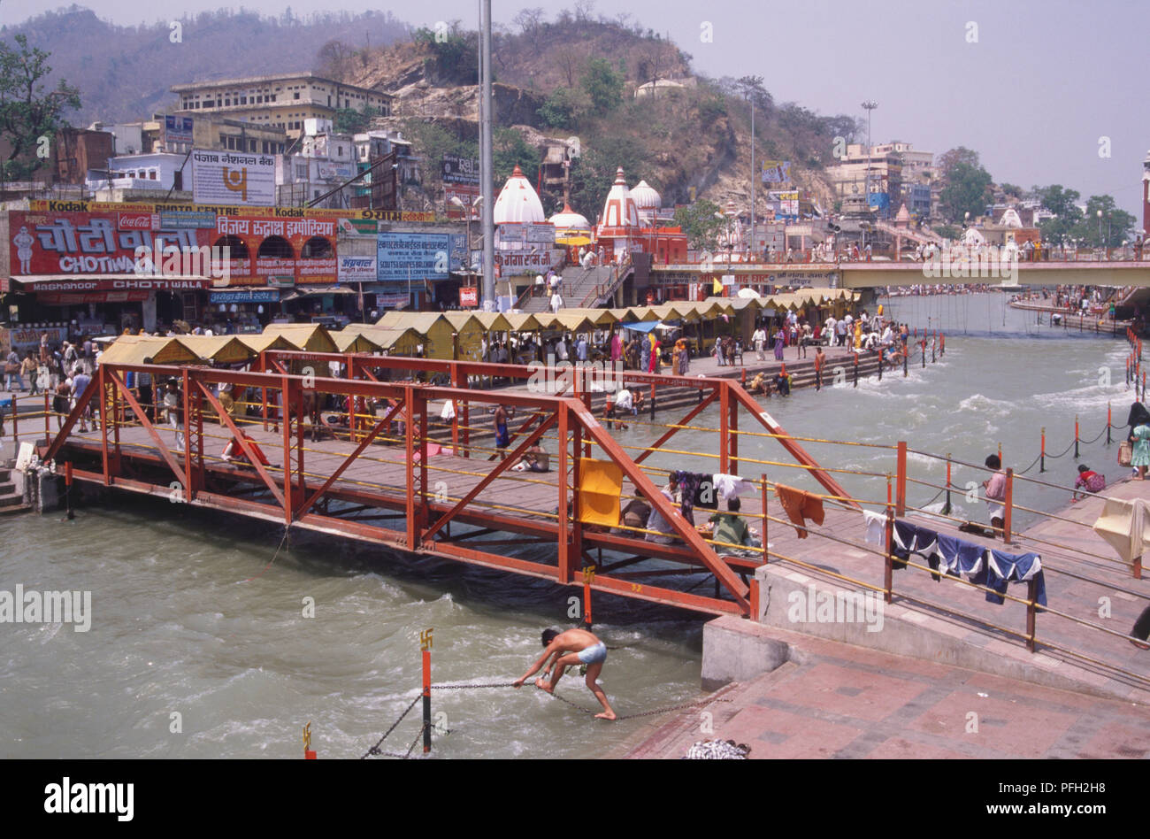 India, Haridwar, pilgrims dipping in the holy River Ganges, numerous ...