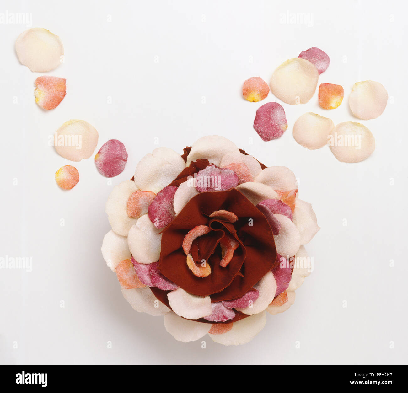 Above view of chocolate flakes and crystallized rose petals Stock Photo ...