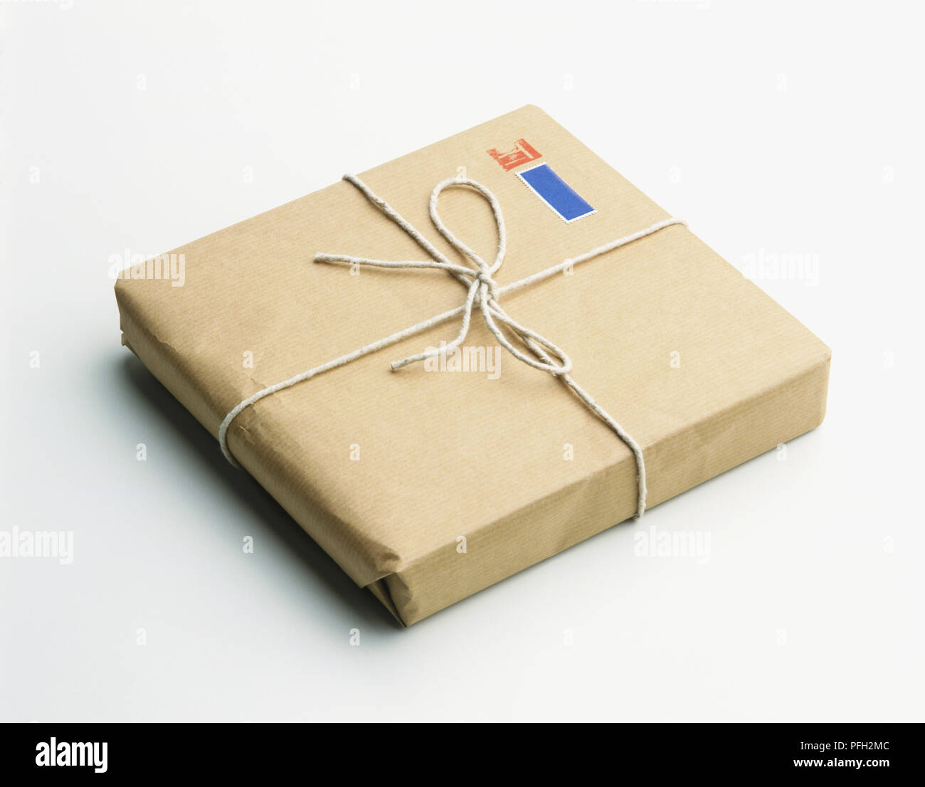 Parcel wrapped with string Stock Photo - Alamy