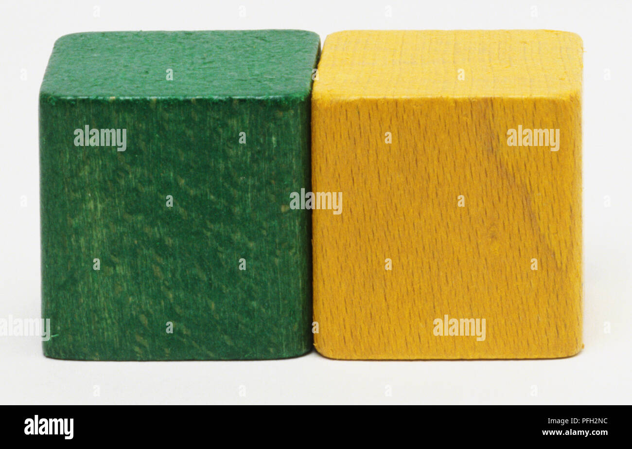 A green and yellow wooden block side by side each other Stock Photo - Alamy