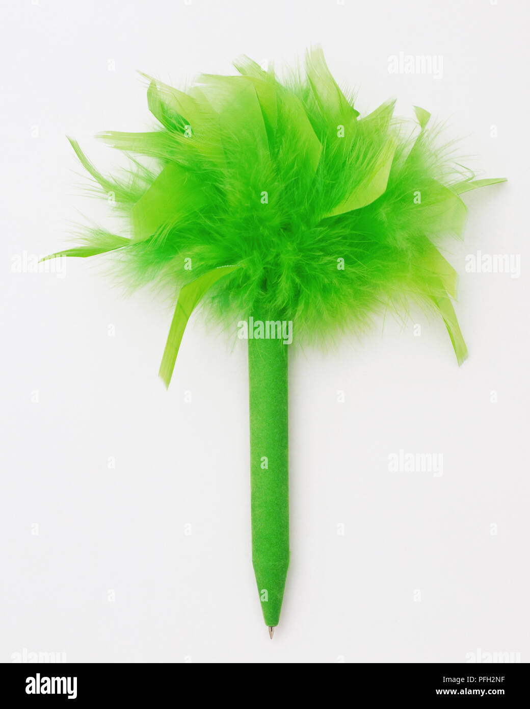 Green pen topped with fluffy ball of feathers Stock Photo - Alamy