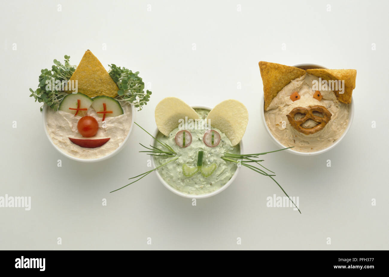 Bowls containing food made in to the shape of faces Stock Photo - Alamy