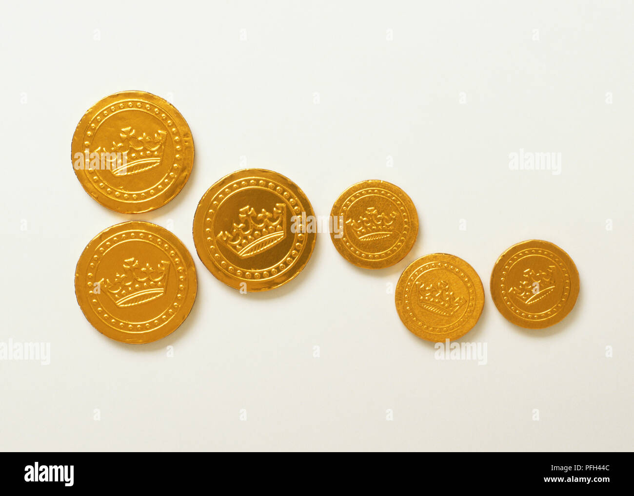 Six gold coins Stock Photo - Alamy