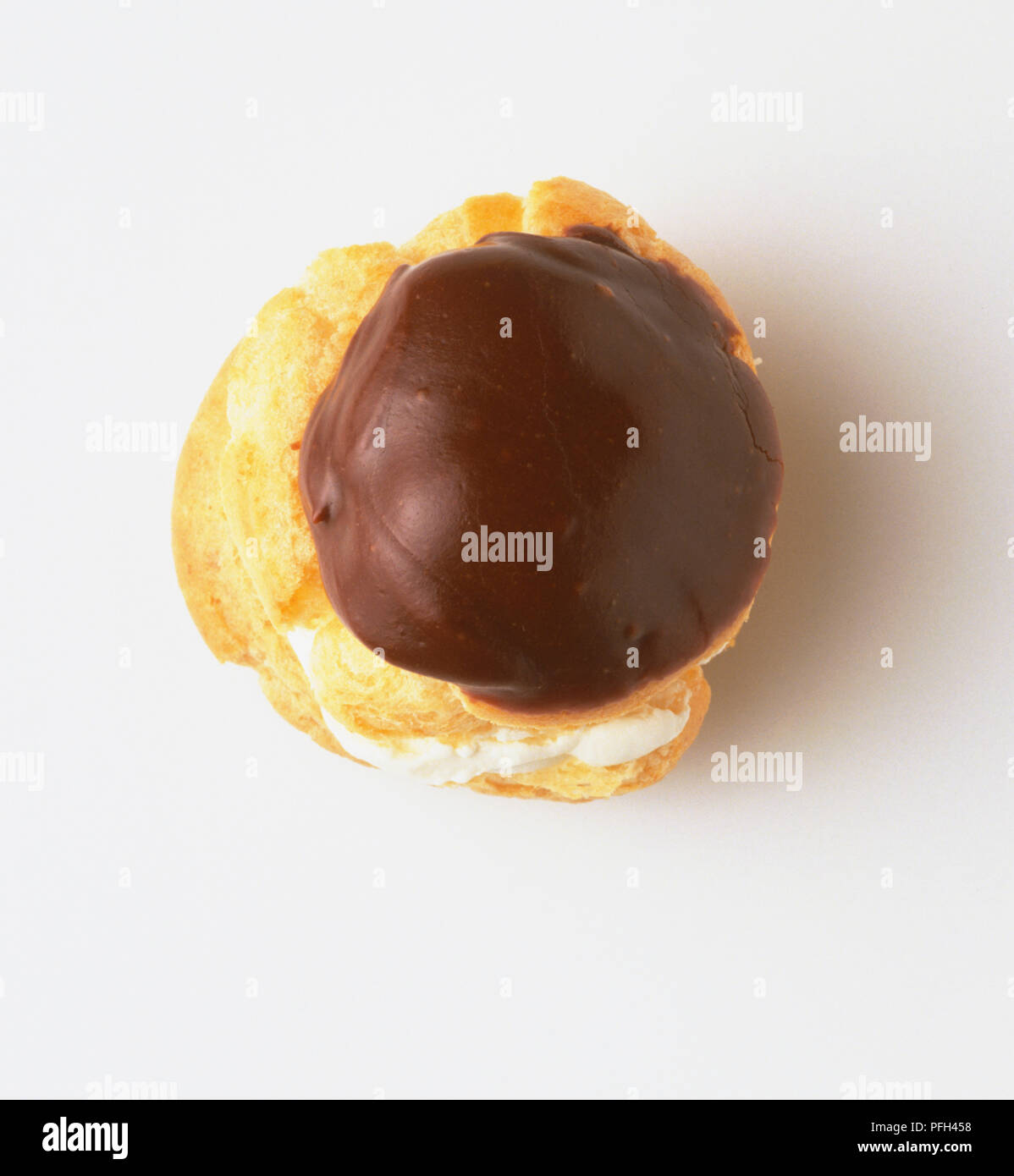 Chocolate coated profiterole Stock Photo - Alamy