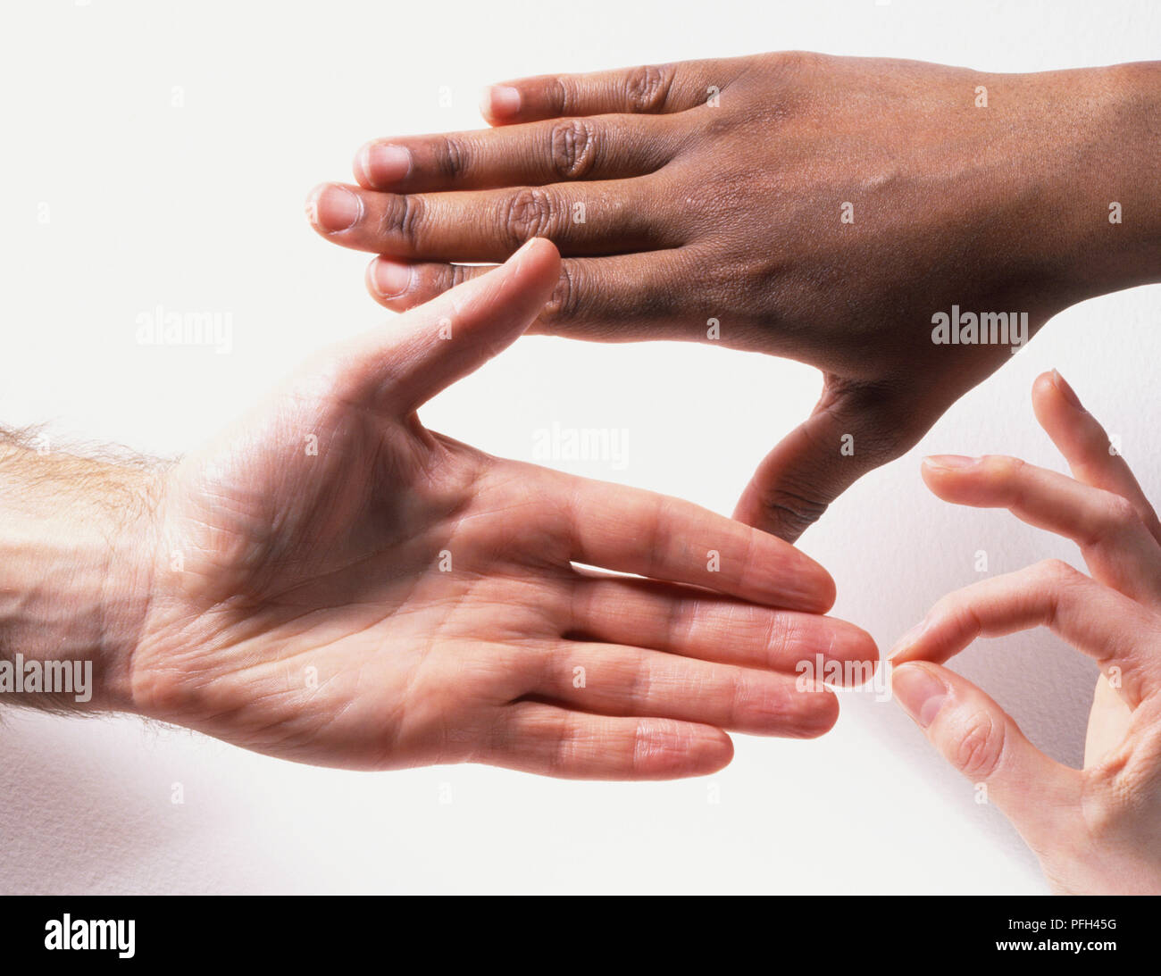 Palm of hand showing a white skin tone, and back of a hand showing a ...