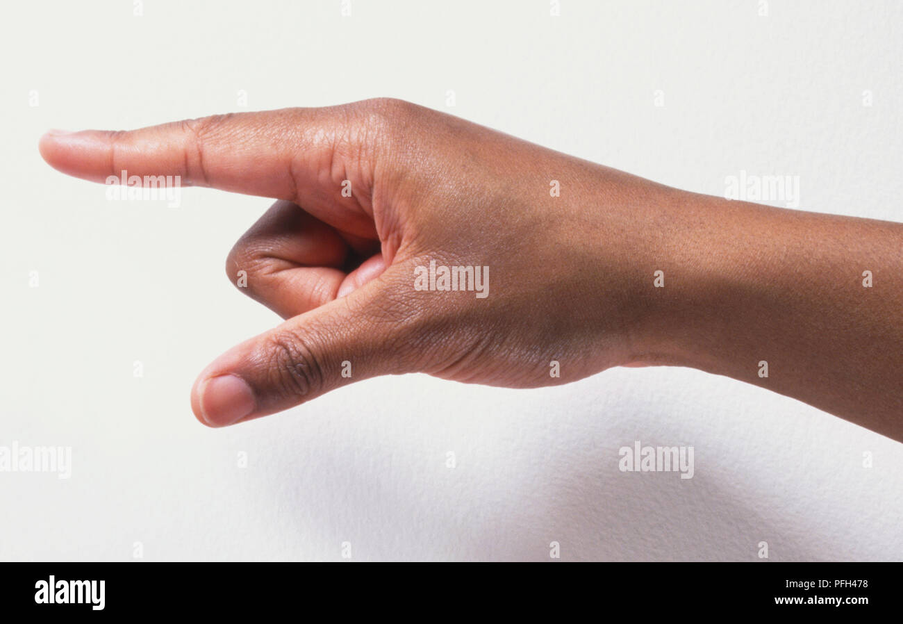 Hand with index finger pointing, side view Stock Photo - Alamy