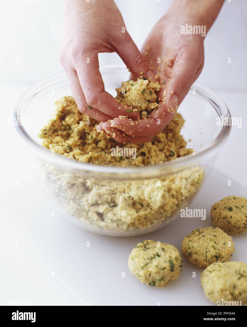 Falafel mixture being moulded into balls, side view Stock Photo - Alamy