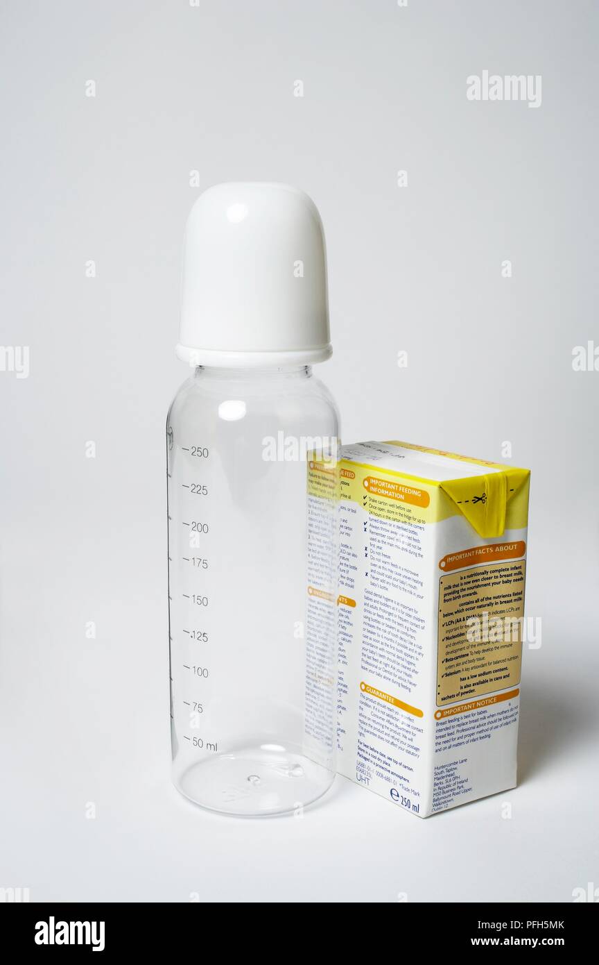 Empty baby bottle next to carton of baby milk Stock Photo - Alamy
