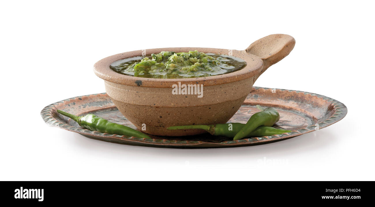South East Asian-style spice paste in a bowl, and fresh green chilli ...