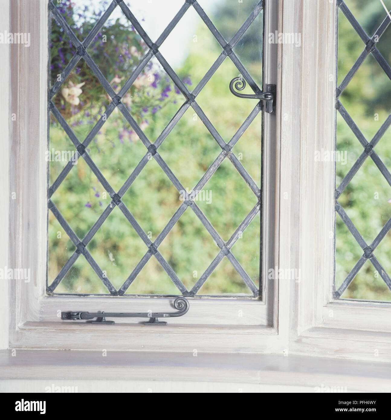 View through a lattice window onto garden Stock Photo - Alamy
