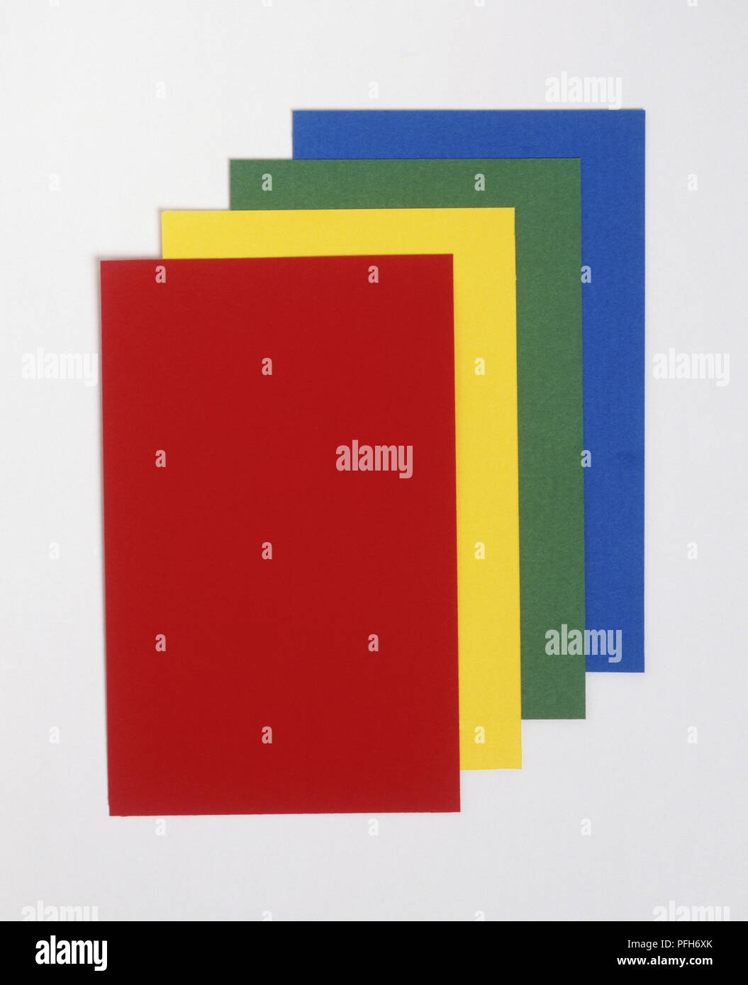 Four A4 size pieces of coloured paper, red, yellow, green and blue ...