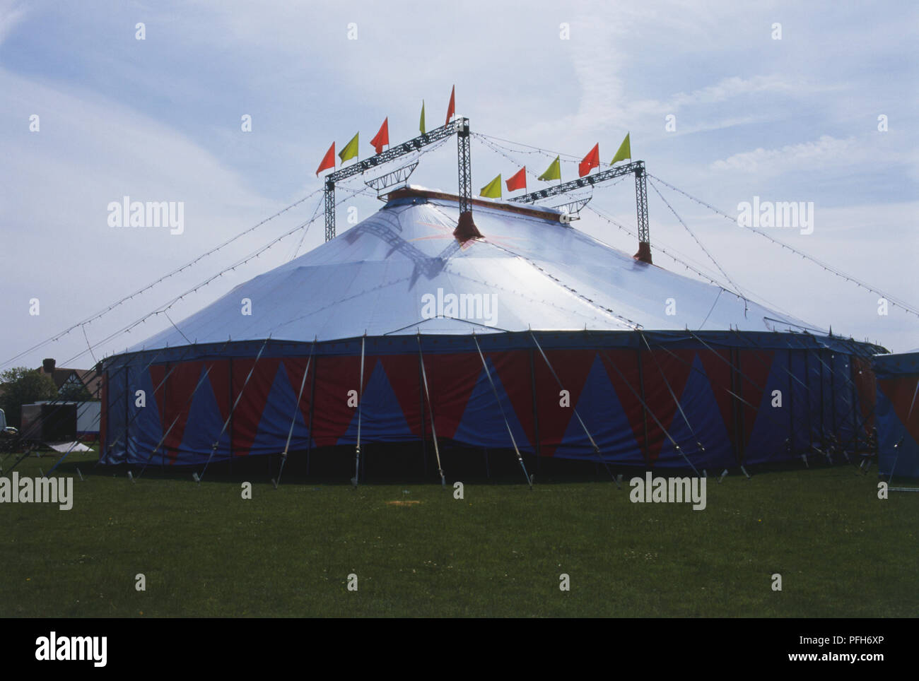 Circus tent with flags mounted on top Stock Photo - Alamy