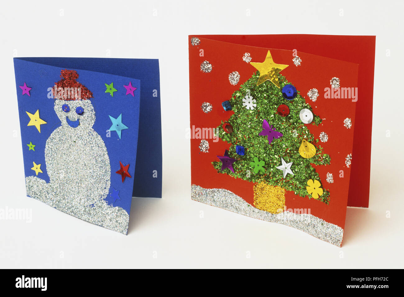 Two Christmas cards, blue and red card, decorated with a snowman and a ...