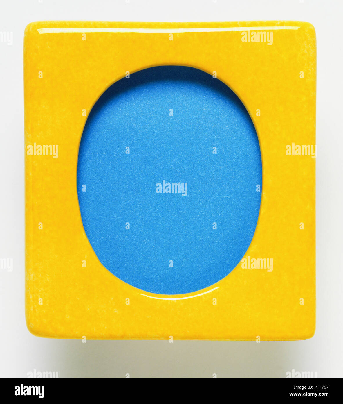Yellow picture frame with blue background Stock Photo - Alamy