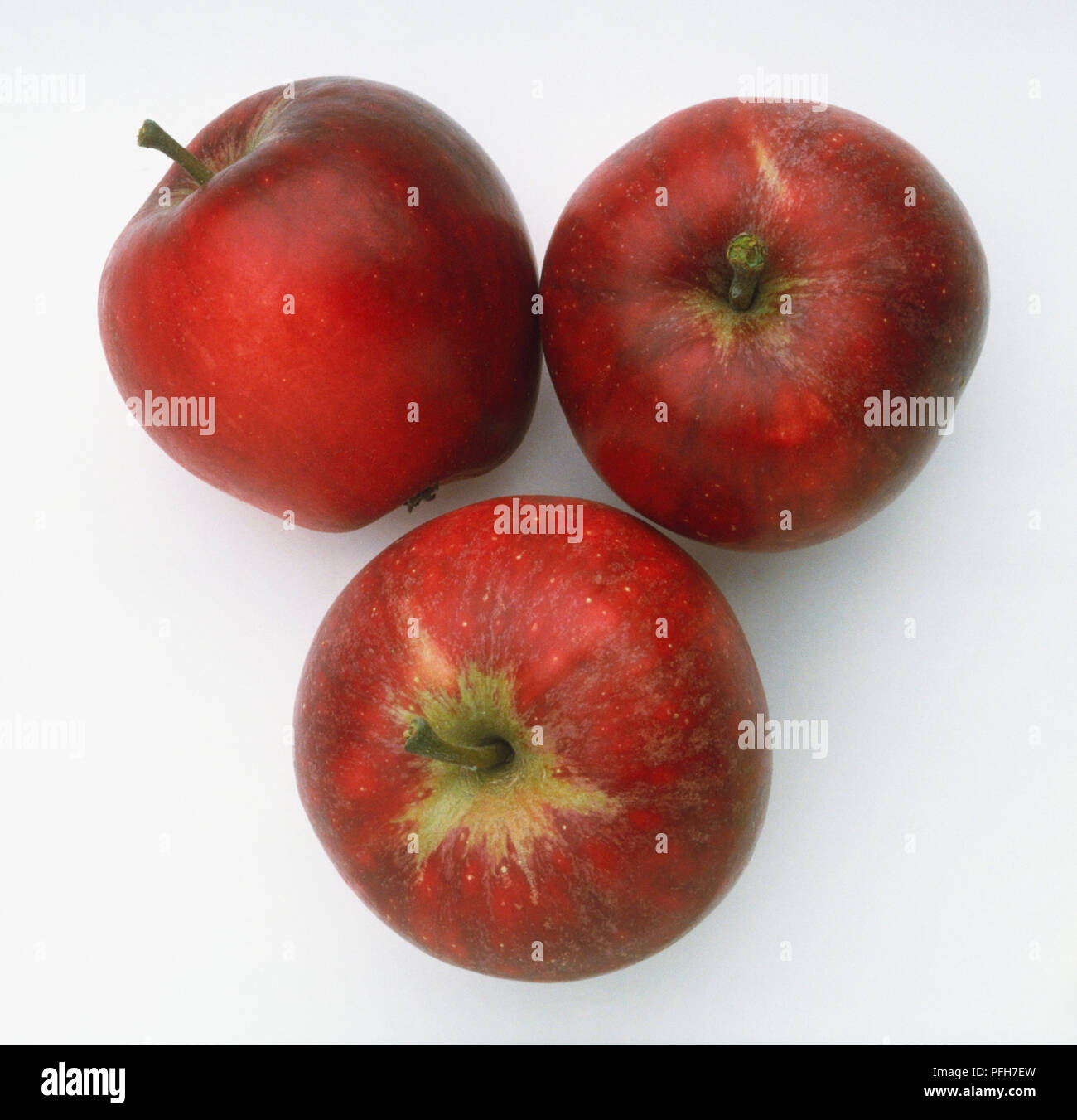 Apple 'Katia', three red apples Stock Photo - Alamy
