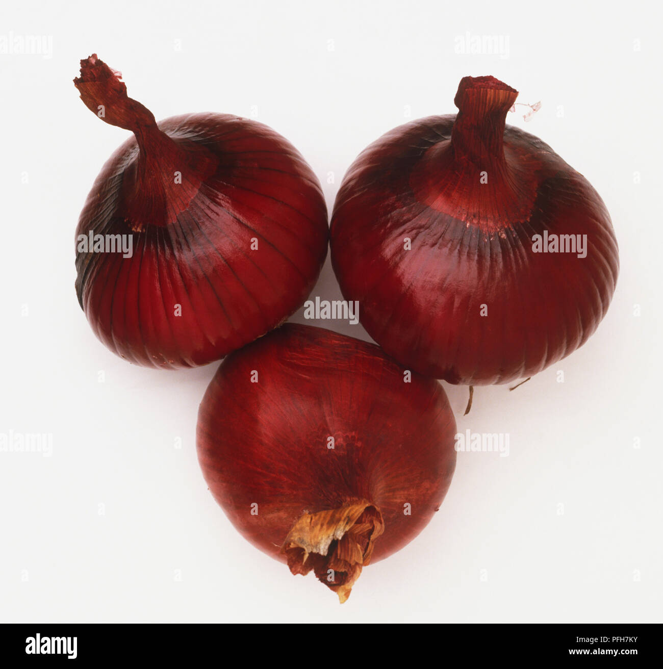 Three red Onions Stock Photo - Alamy