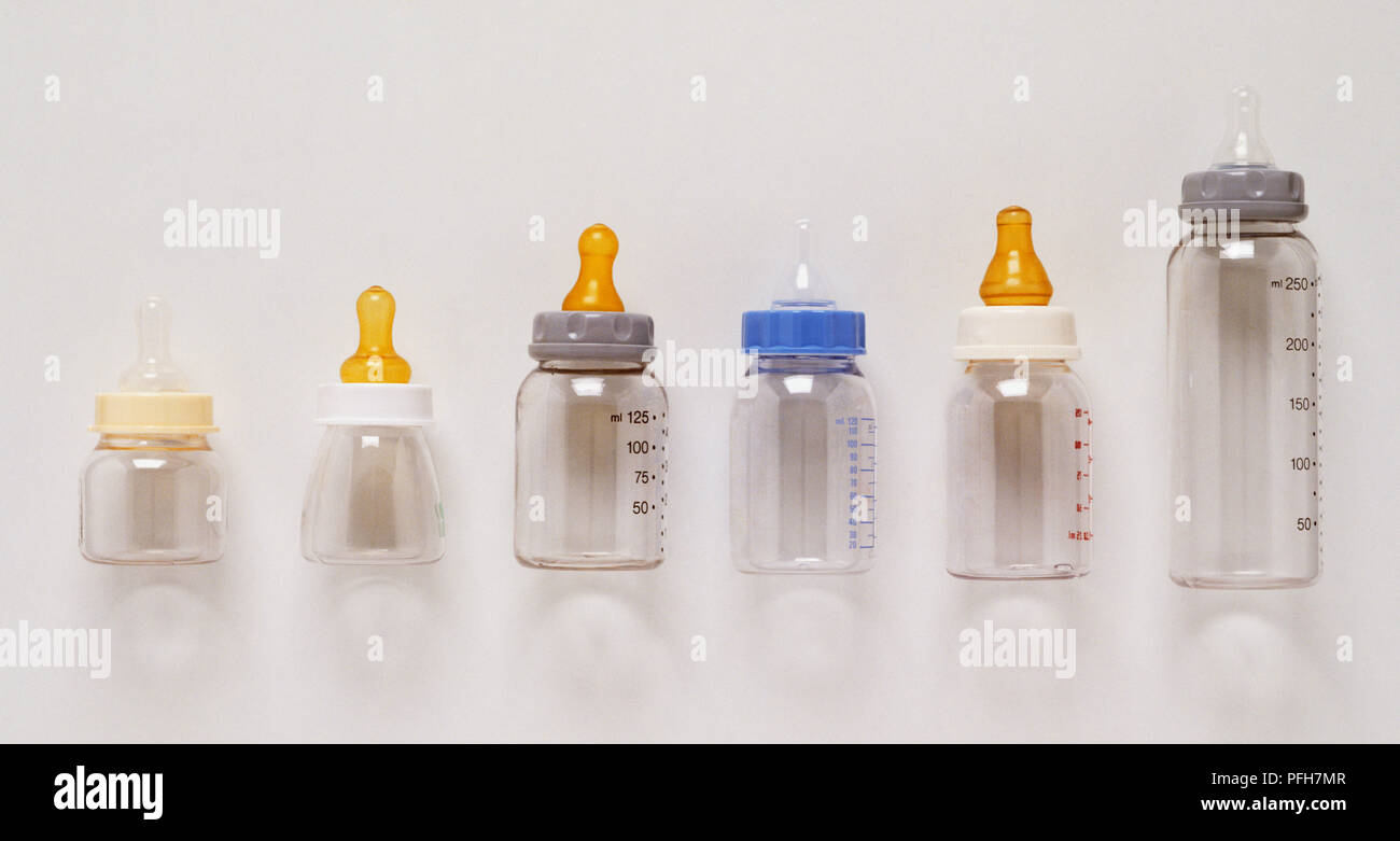 Six baby bottles Stock Photo - Alamy