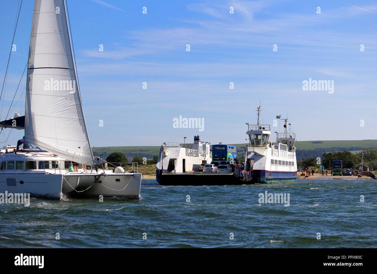 Sandbanks, Dorset, England - June 02 2018: A sailing catamaran passes ...