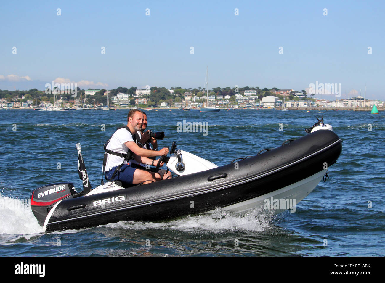 Poole, Dorset, England - June 02 2018: Two caucasian men driving fast ...