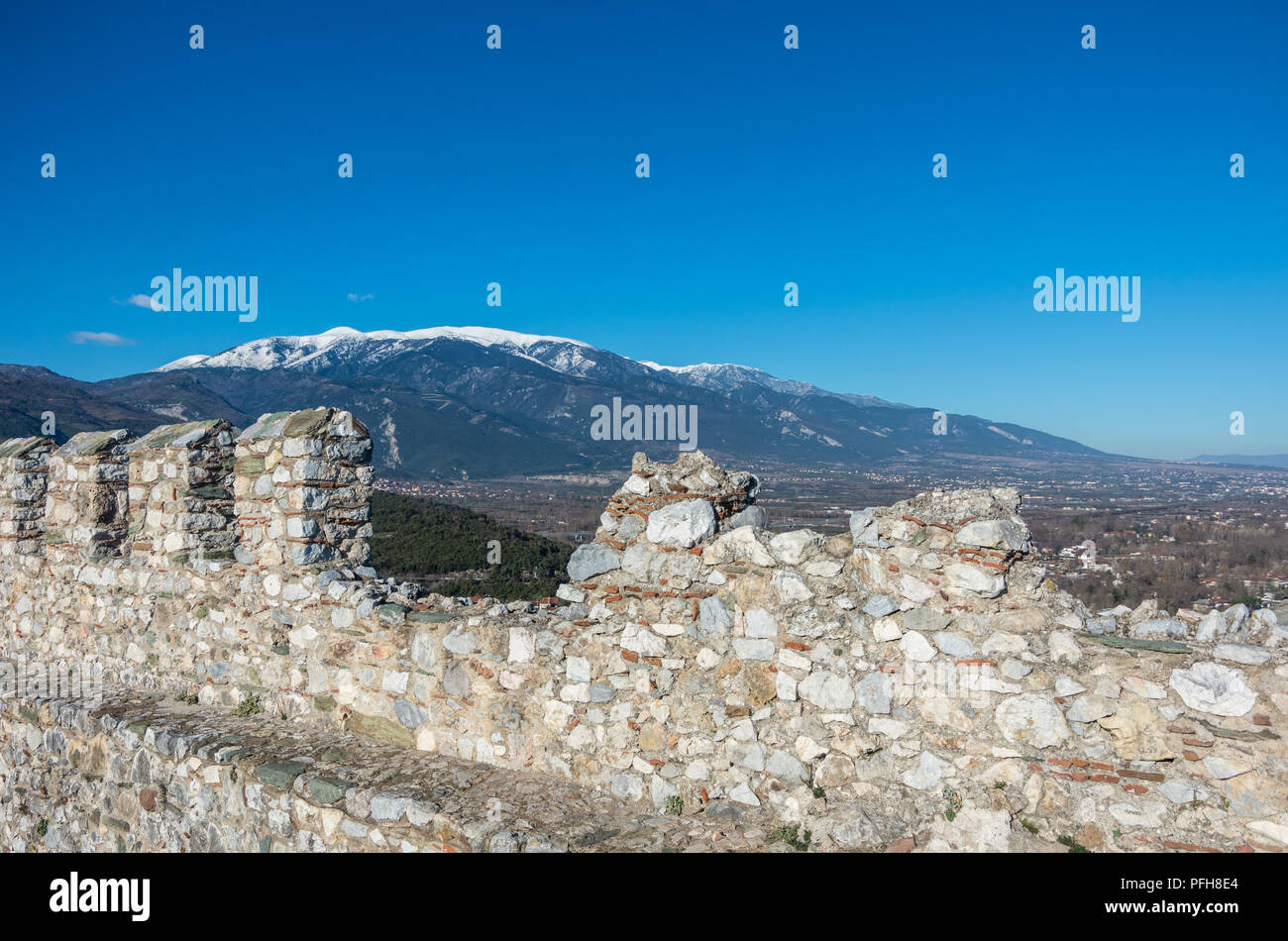 Wall of medieval castle of Platamonas with Olympus mountain at ...