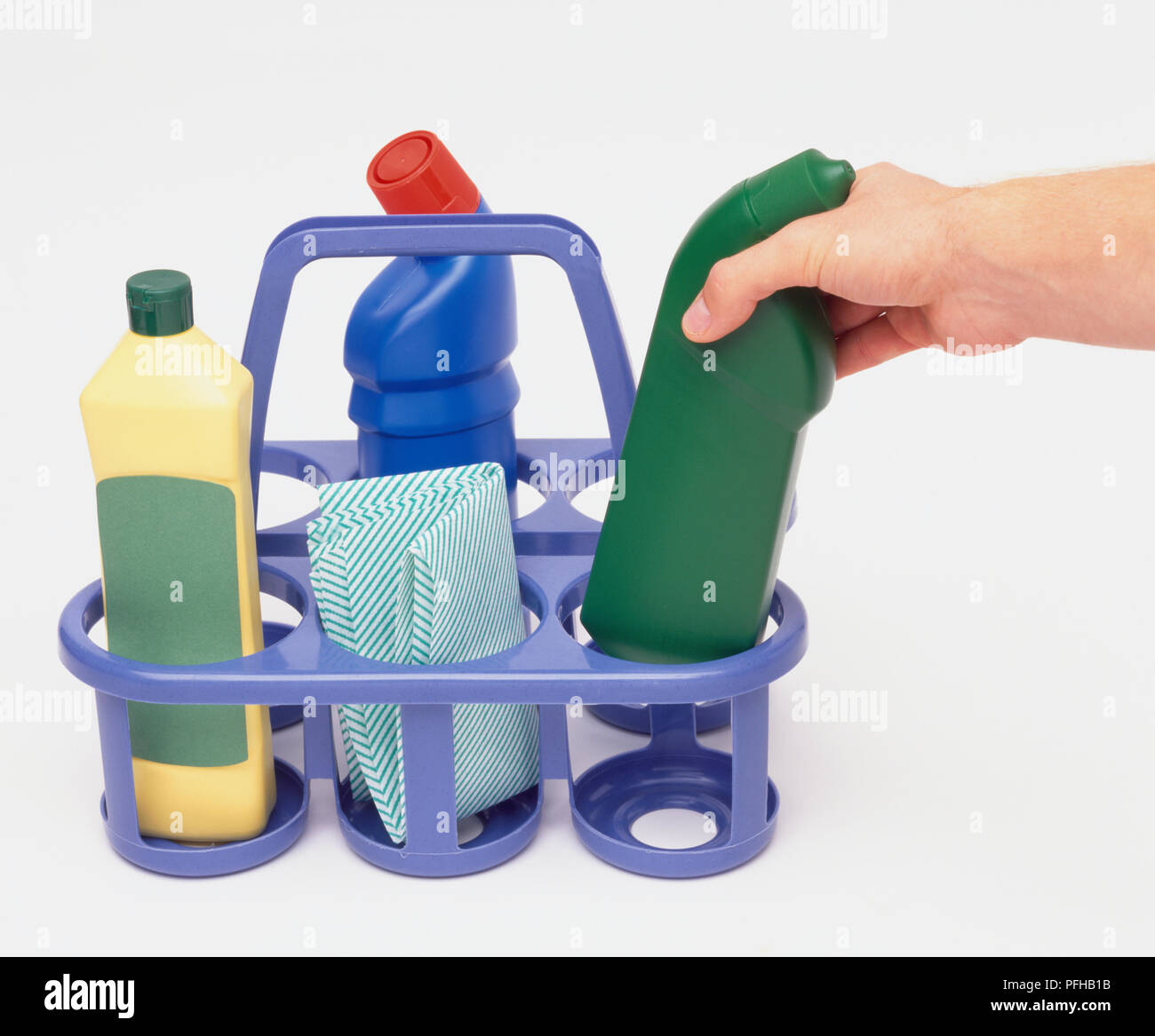 Cleaning equipment being put into plastic bottle carrier Stock Photo ...