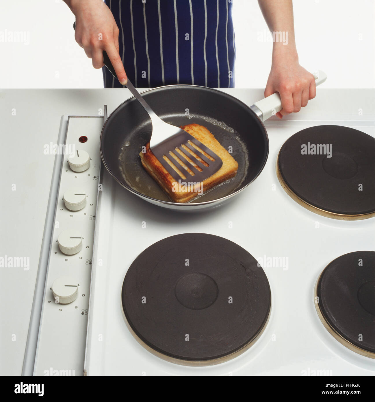 Frying a ham and cheese sandwich Stock Photo - Alamy