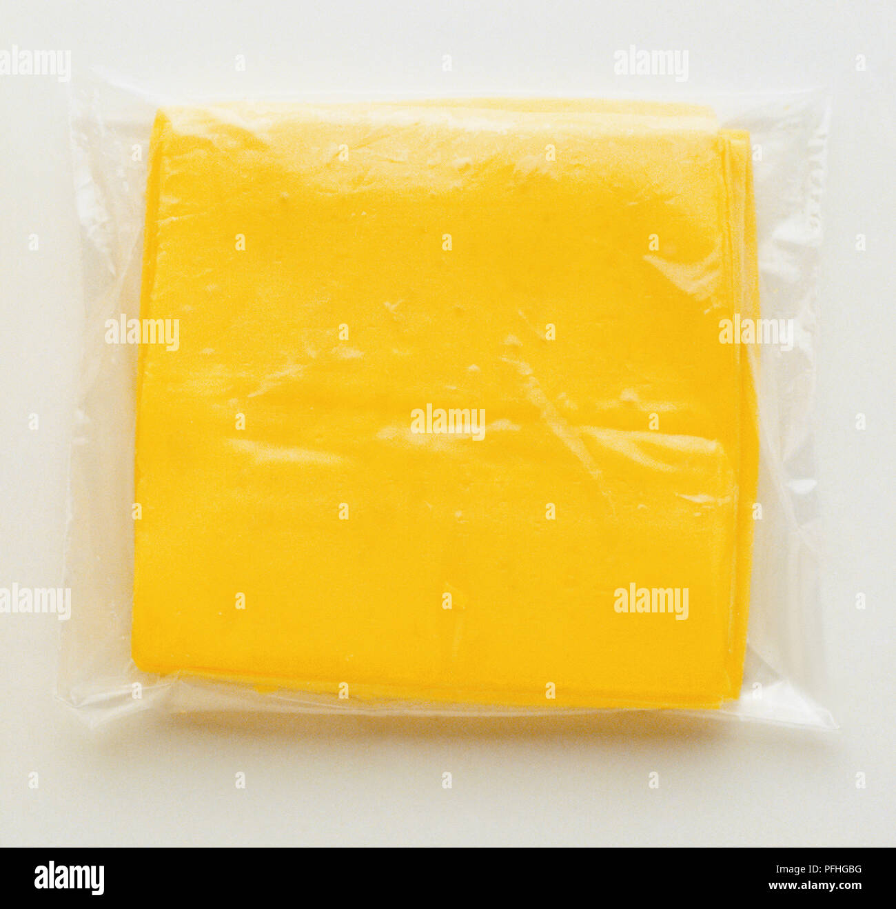 A vacuum wrapped, rectangular, piece of processed cheese Stock Photo ...