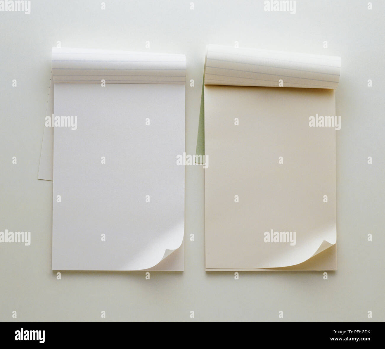 Two notepads, pages folded back Stock Photo - Alamy