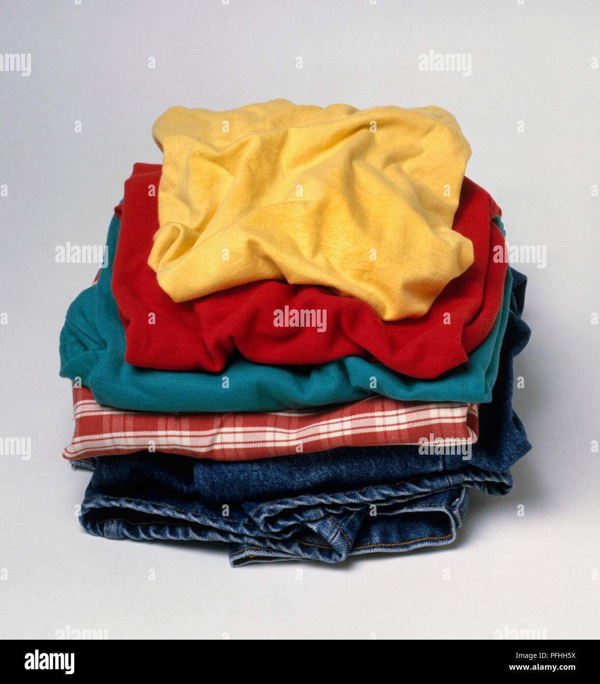 Clothes folded in pile Stock Photo - Alamy