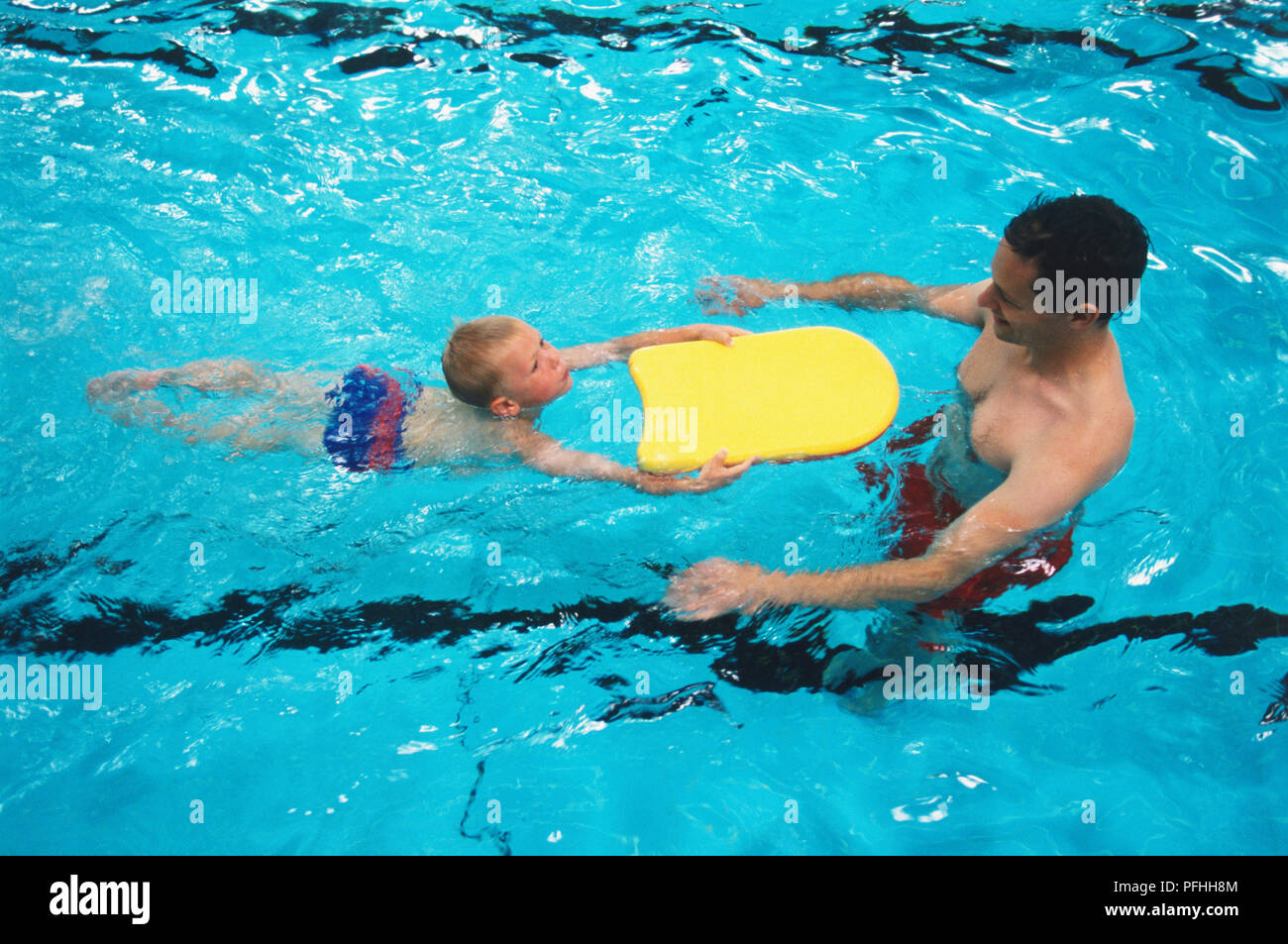 Family using swimming pool hi-res stock photography and images - Alamy