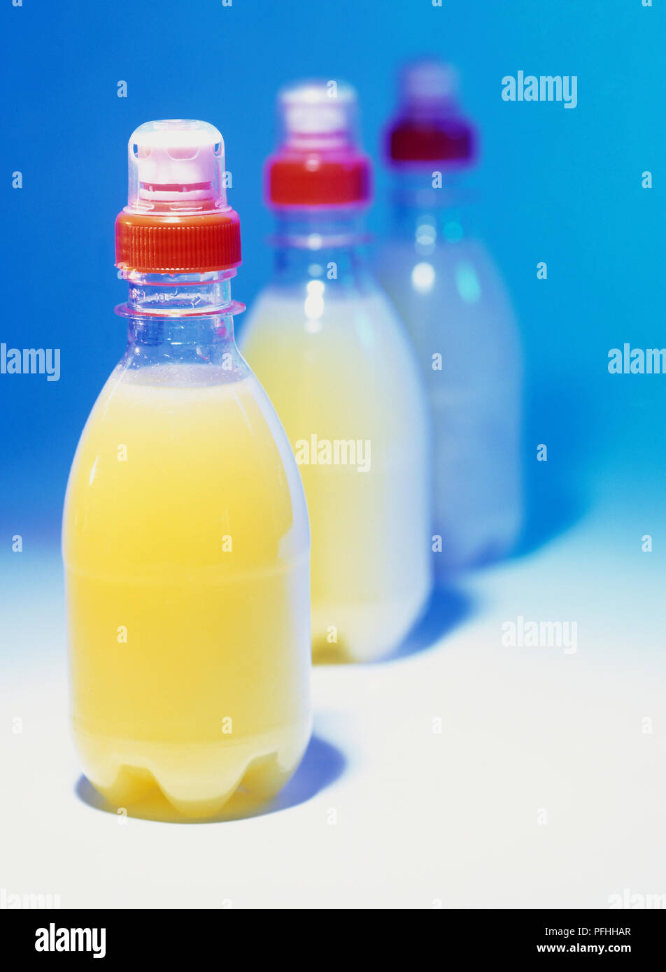 Three plastic bottles of lemonade Stock Photo - Alamy