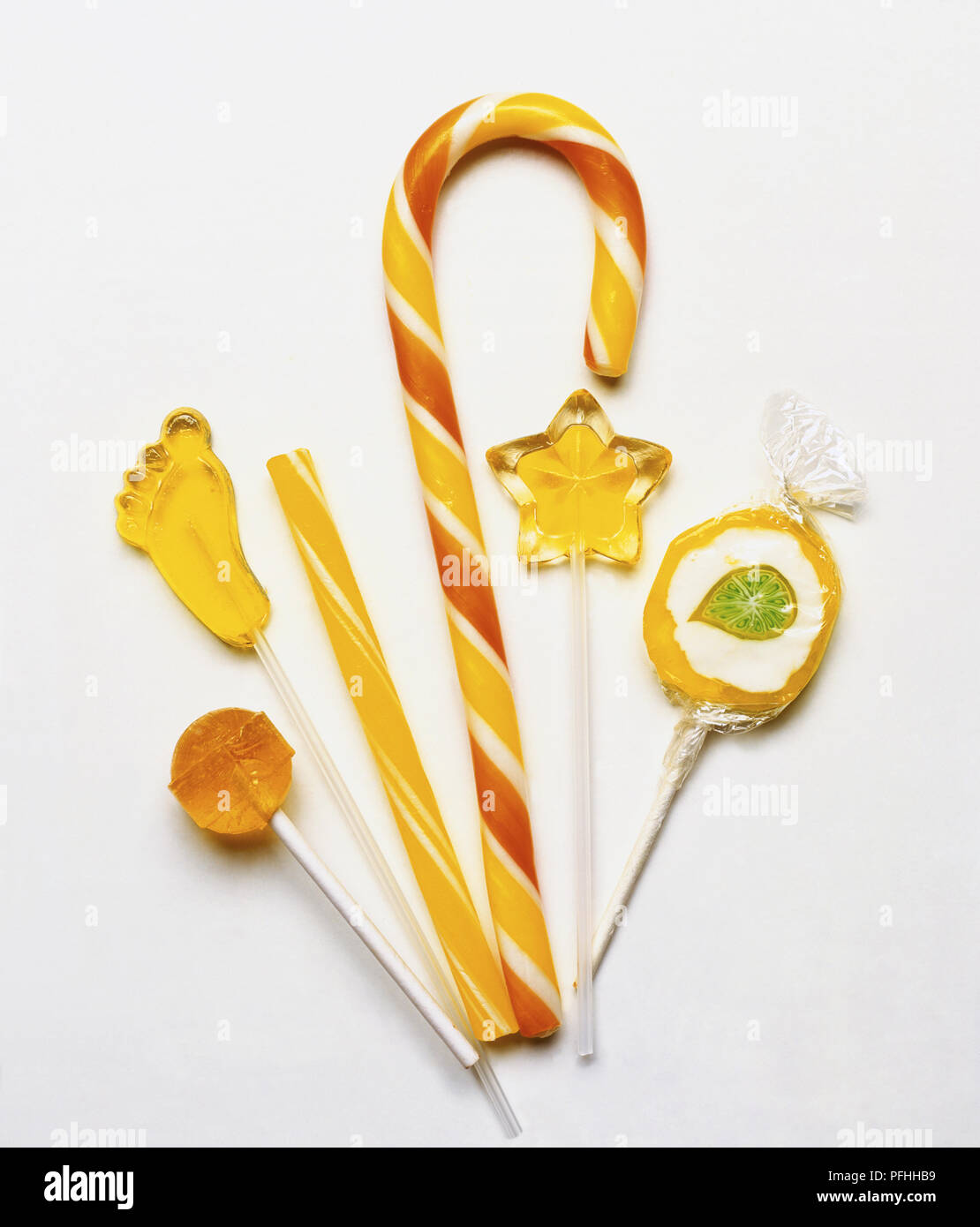 Selection of yellow lollipops and candy sticks Stock Photo - Alamy