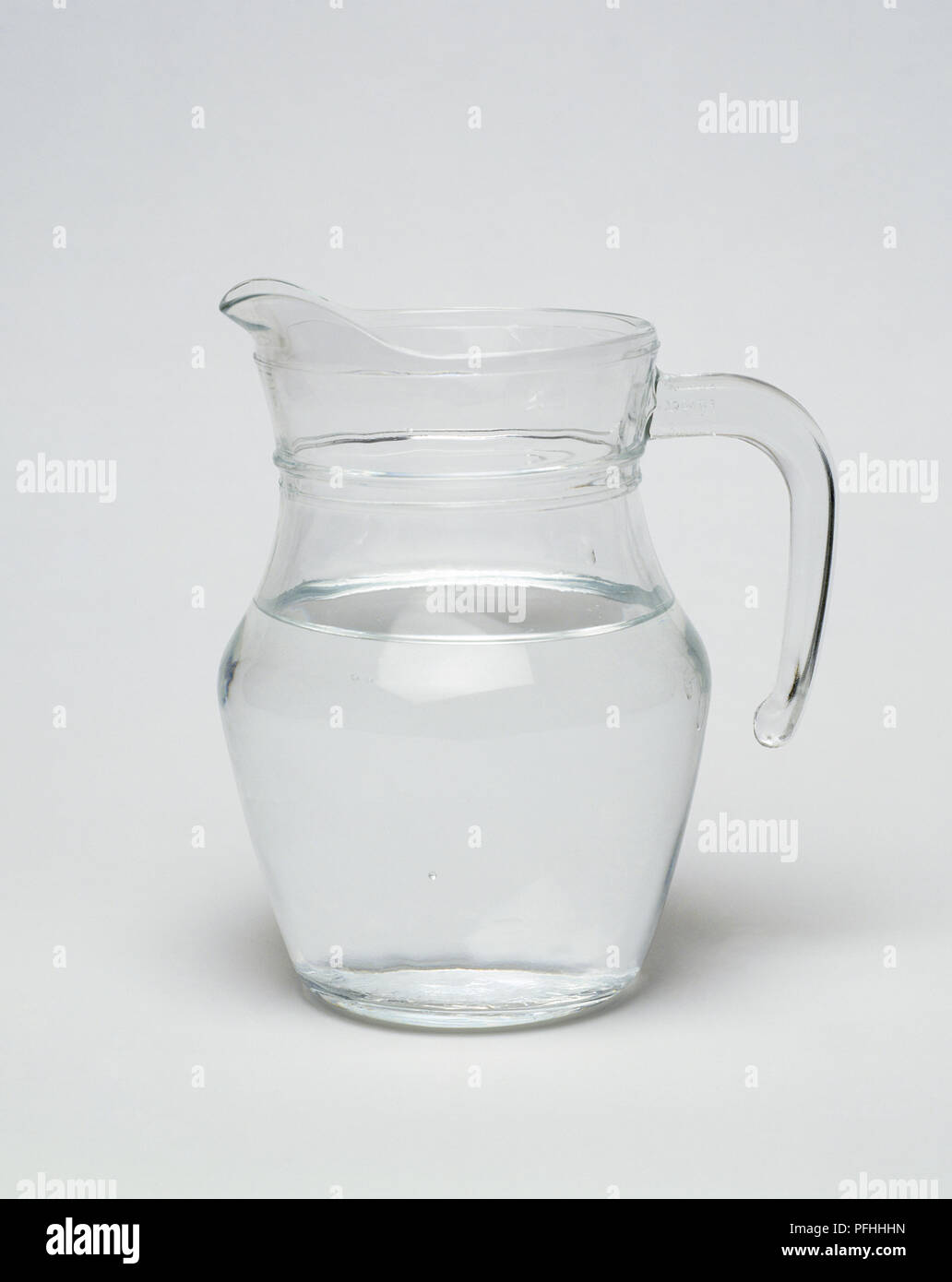 Glass jug full of water, side view Stock Photo - Alamy