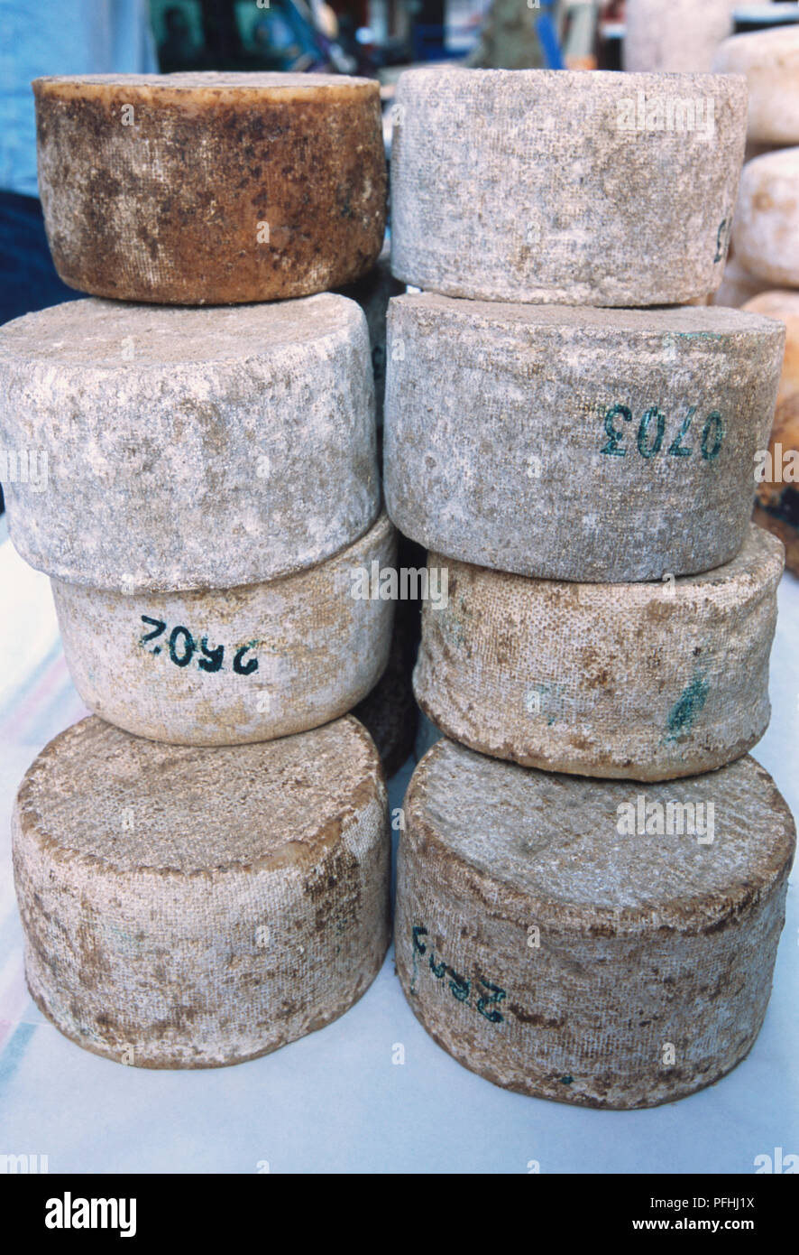 Stacked circular blocks of Brebis cheese Stock Photo - Alamy
