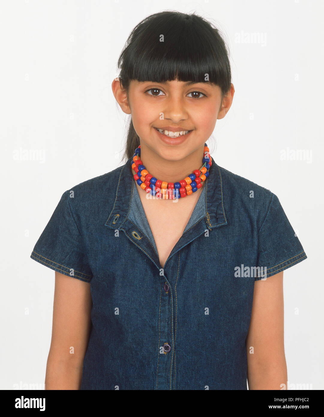 Girl wearing a beaded necklace Stock Photo - Alamy