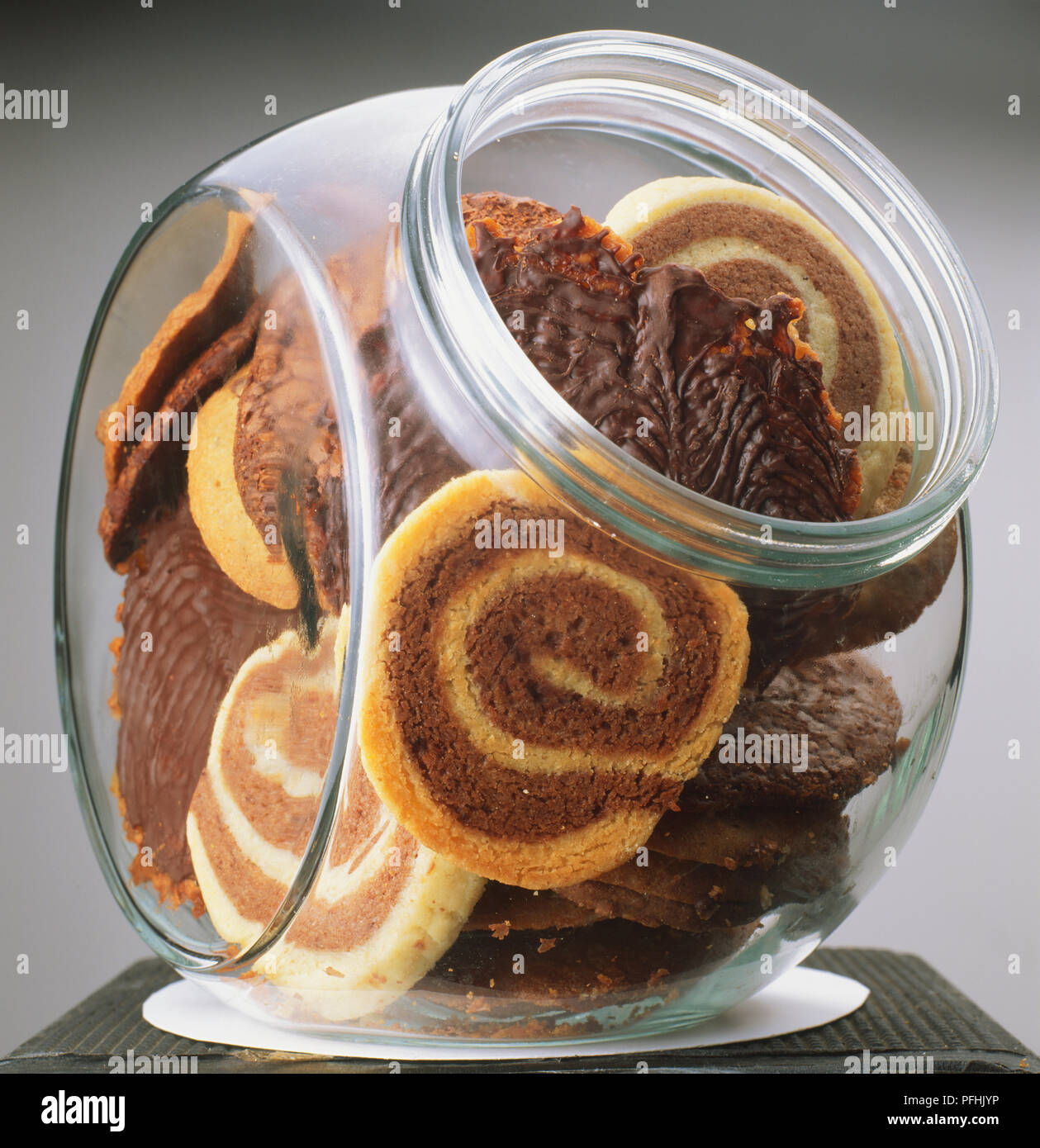 Assorted chocolate biscuits in glass jar, close up Stock Photo - Alamy