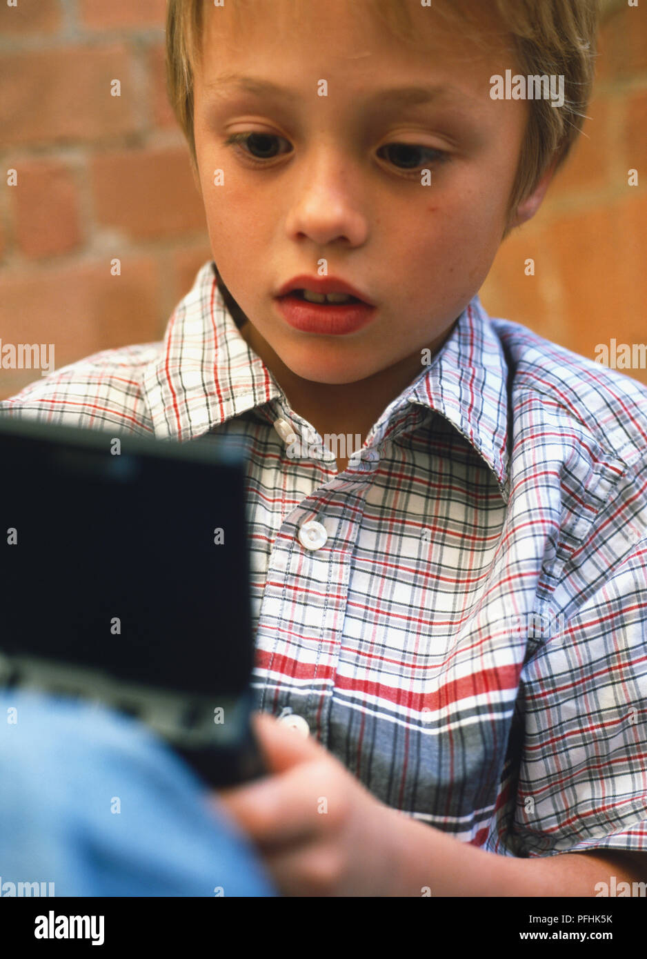 Hand held computer game hi-res stock photography and images - Alamy