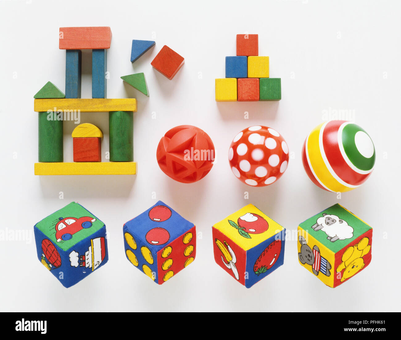 Selection of toys, including cubes, balls, wooden toy building blocks ...