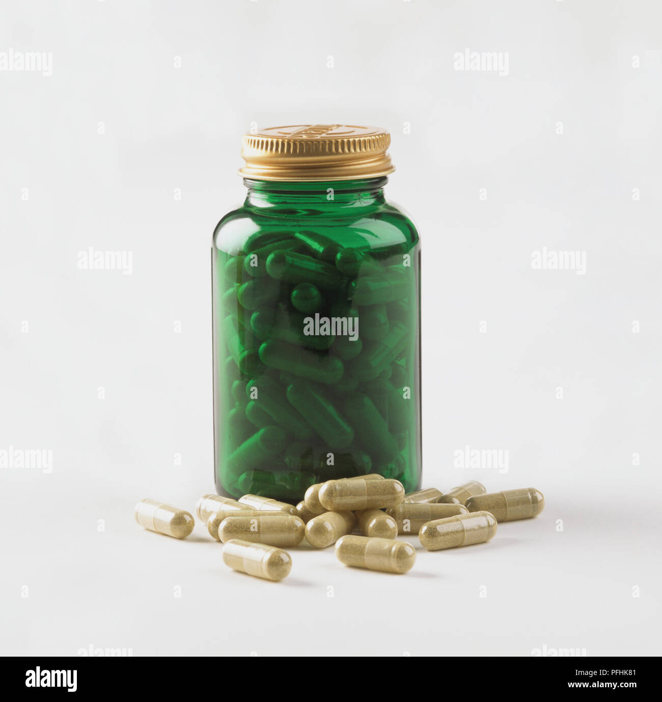 White medicinal capsules in glass hi-res stock photography and images ...