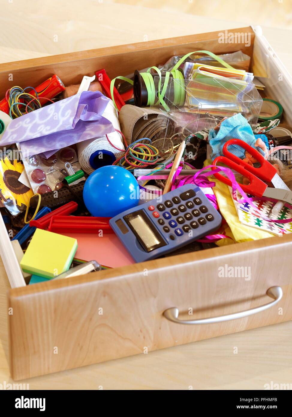 Cluttered drawer on a desktop Stock Photo - Alamy