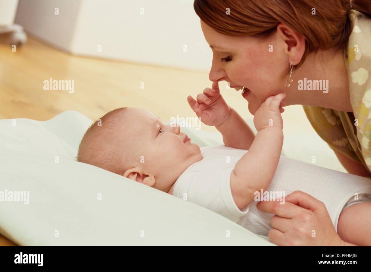 Baby reaching for adult hand hi-res stock photography and images - Alamy