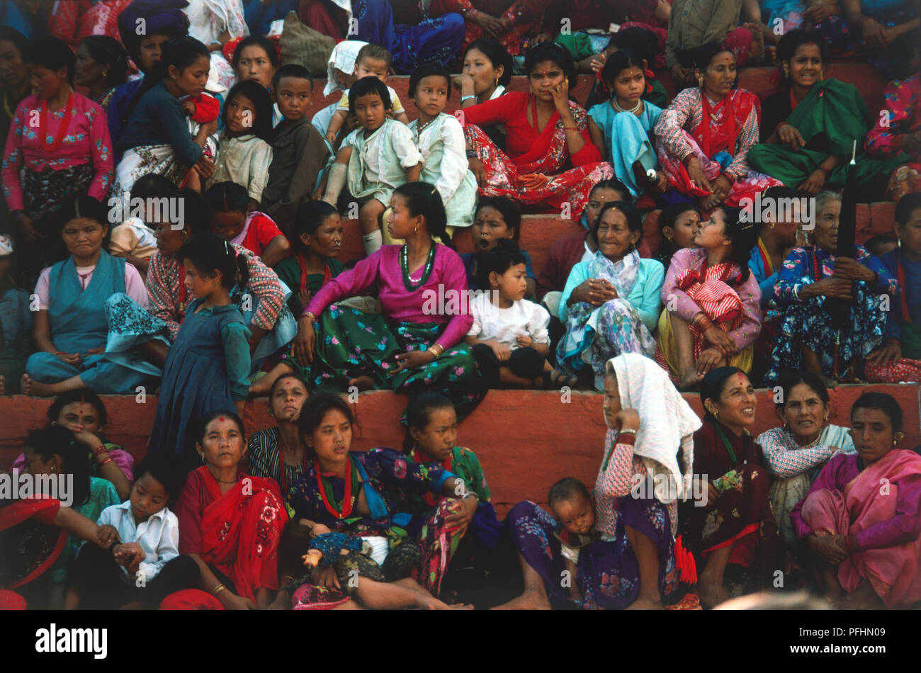 India, Delhi, crowd of women and children sitting on steps Stock Photo ...